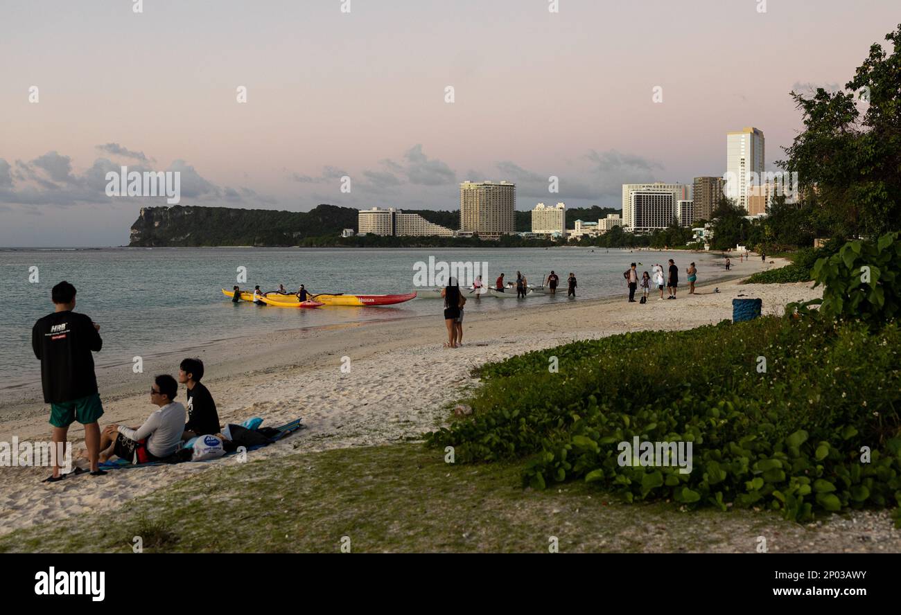 Local residents and visitors of Guam, observe the Pacific Ocean at ...