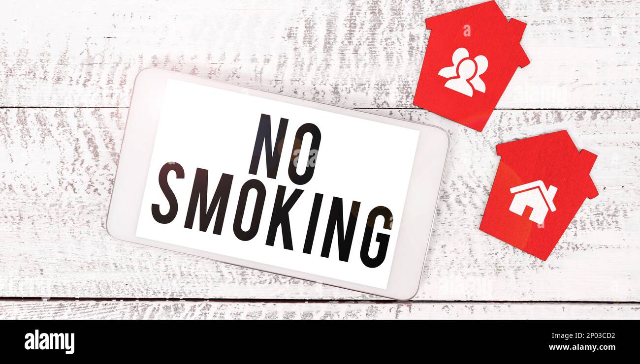 Hand writing sign No Smoking. Business idea using tobacco is forbiden ...