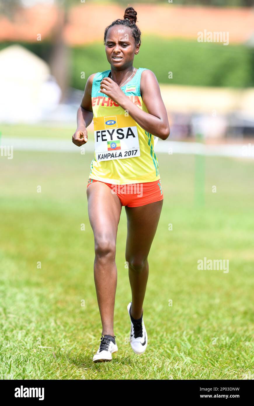 Hawi Feysa (ETH) places second in 18:57 during the under age 20 women's ...