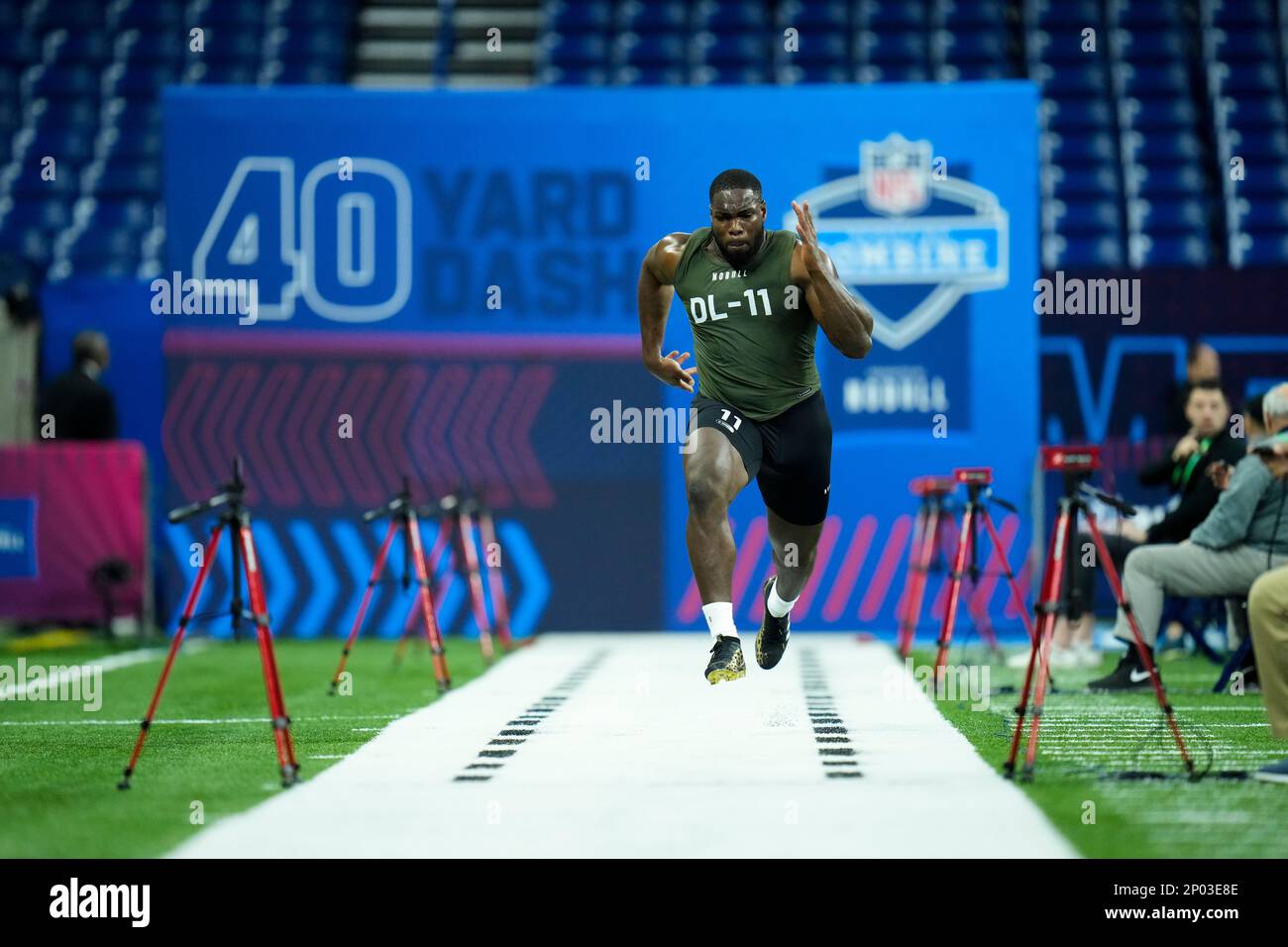 Texas defensive lineman Moro Ojomo runs the 40-yard dash at the NFL ...
