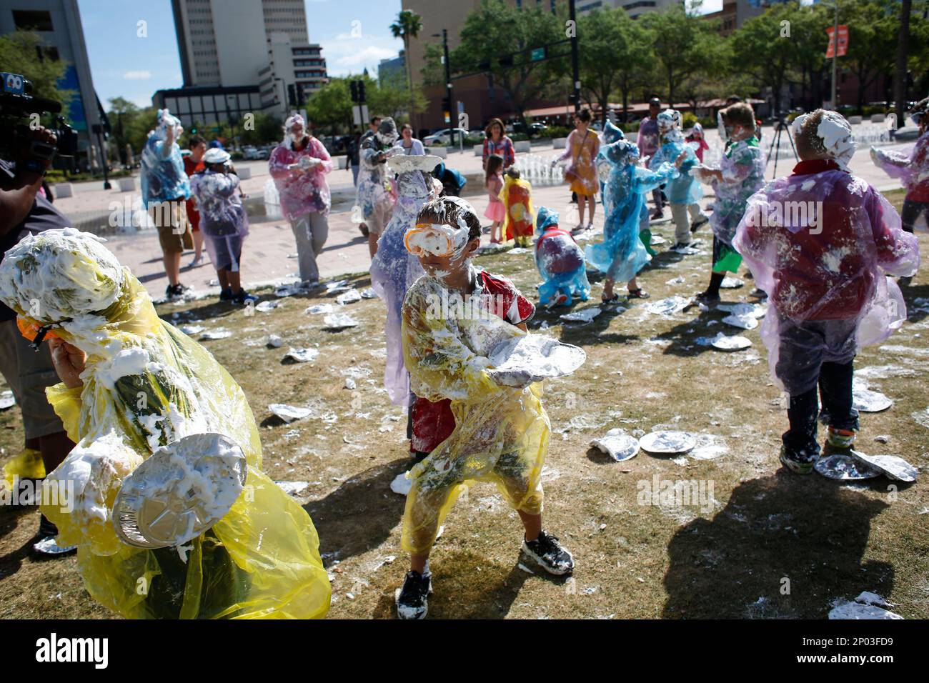 Kids, including, center, Tyler Purgeson, 6, throw pies at each other ...