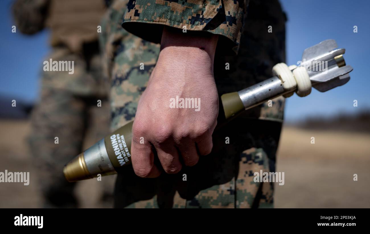 A U.S. Marines with 3d Battalion, 4th Marines prepares to load an M224 ...