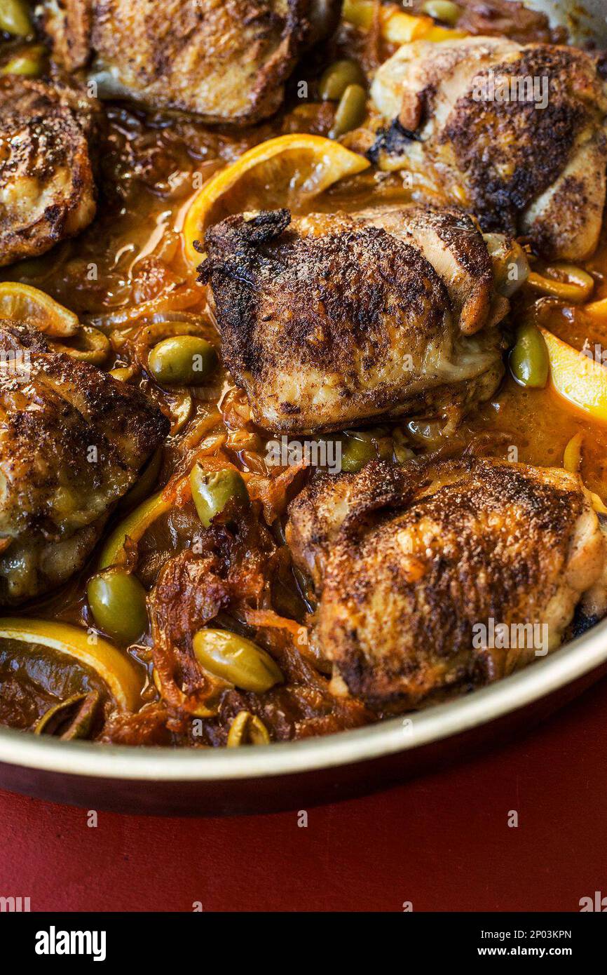 This February 2017 photo shows braised chicken with green olives and ...