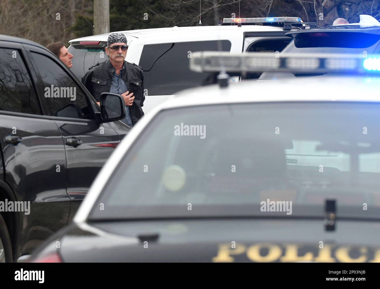 Robbery suspect Dennis Williams is identified by a witness on the scene ...