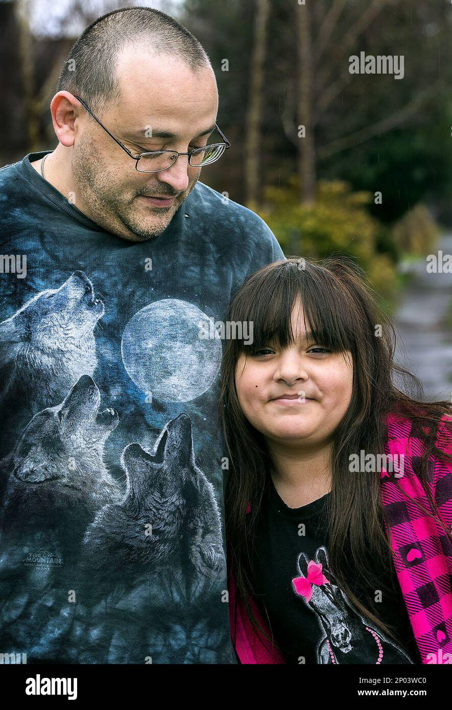 In this March 13, 2017 photo, Mike Romo looks at his daughter, Khia Rom ...