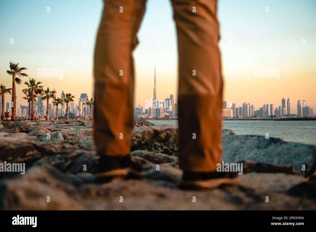 Burj Khalifa, Dubai Cityscape through the legs of tourist, UAE Stock ...