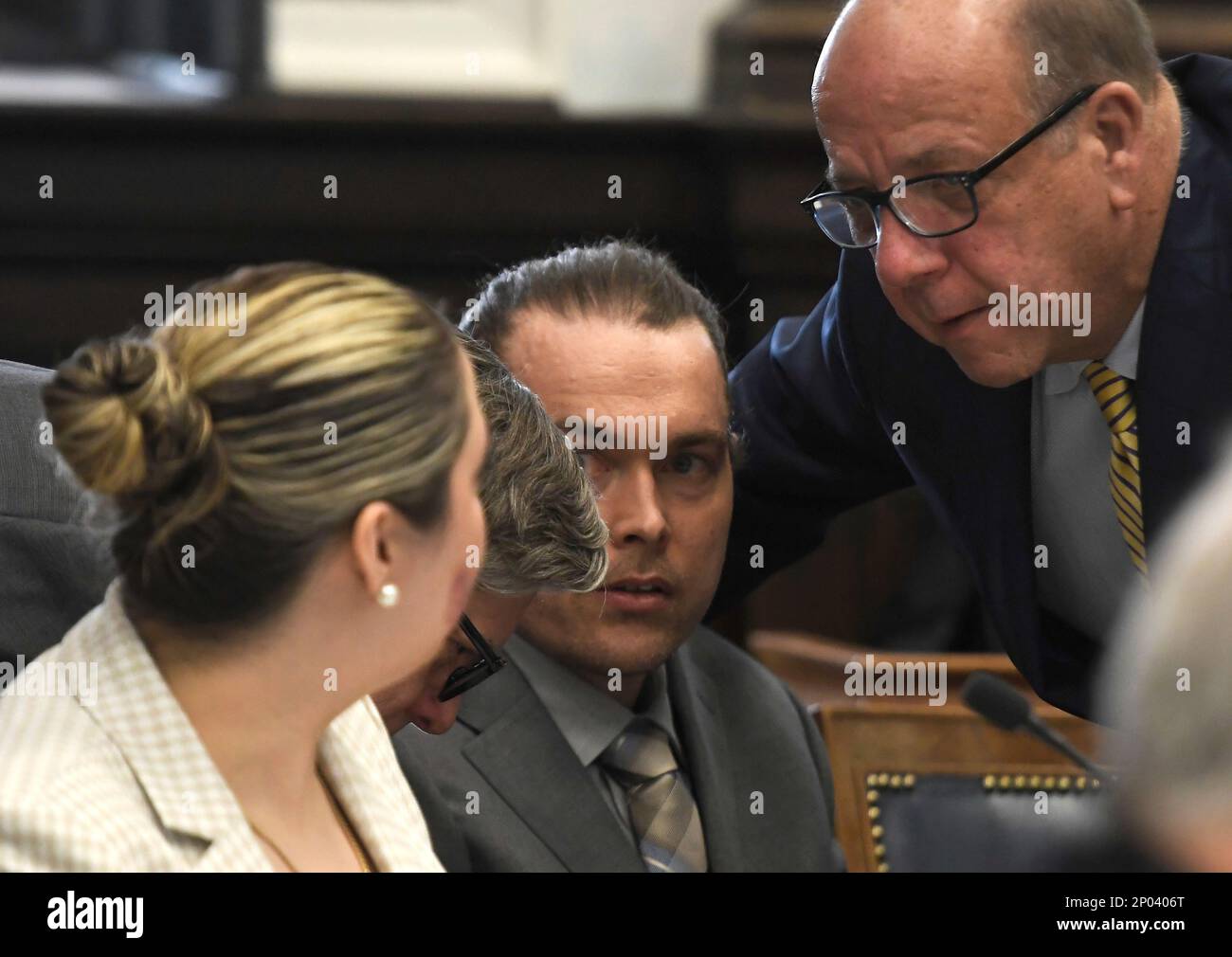 Zachariah Anderson, third from left, listens to his attorneys Nicole ...