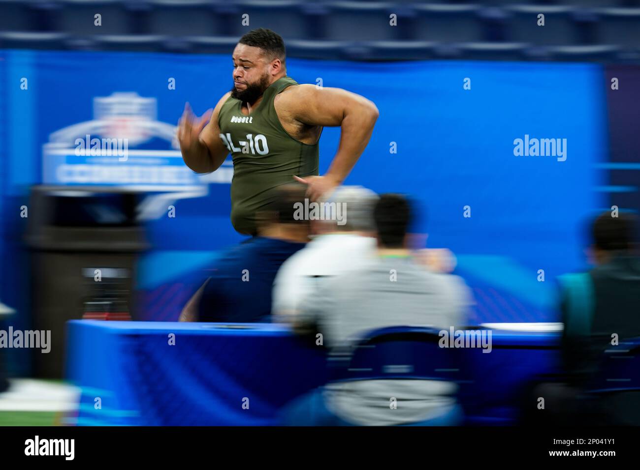 Penn State defensive lineman PJ Mustipher runs a drill at the NFL ...