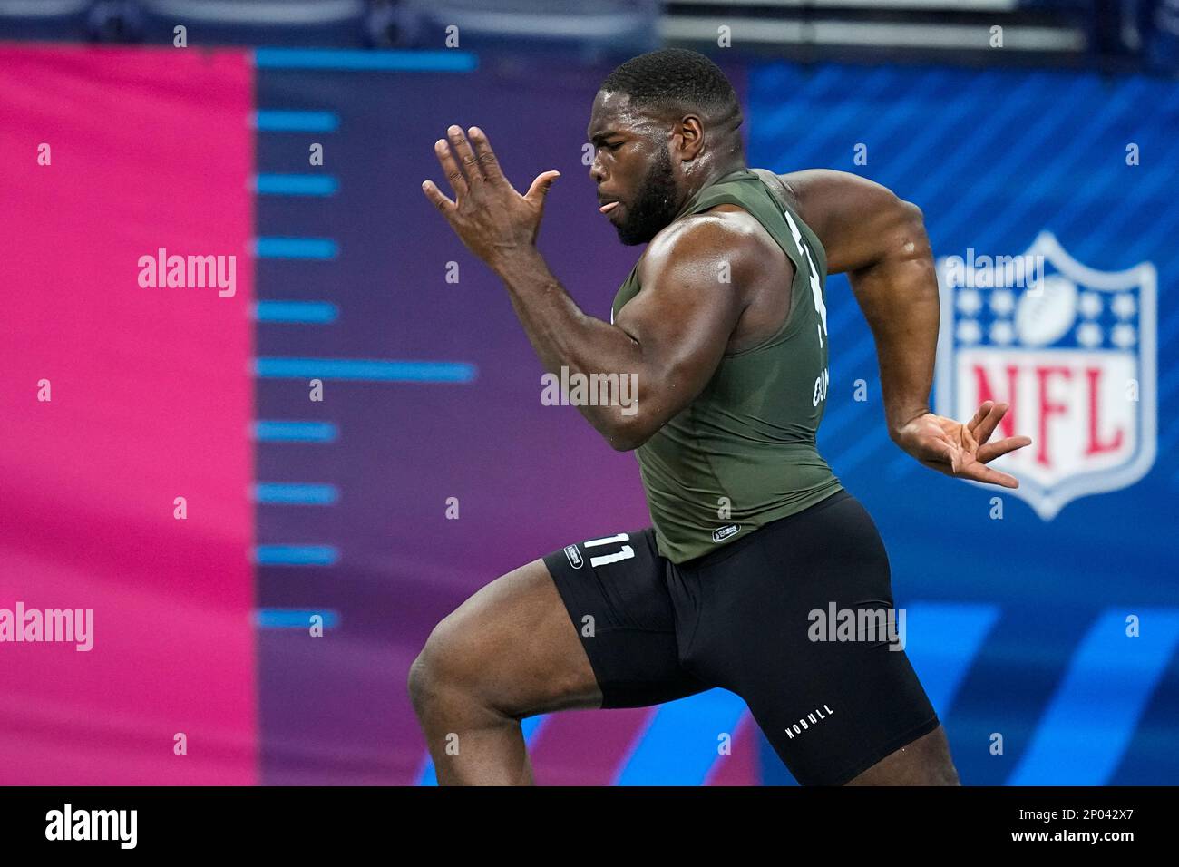 Texas defensive lineman Moro Ojomo runs a drill at the NFL football ...