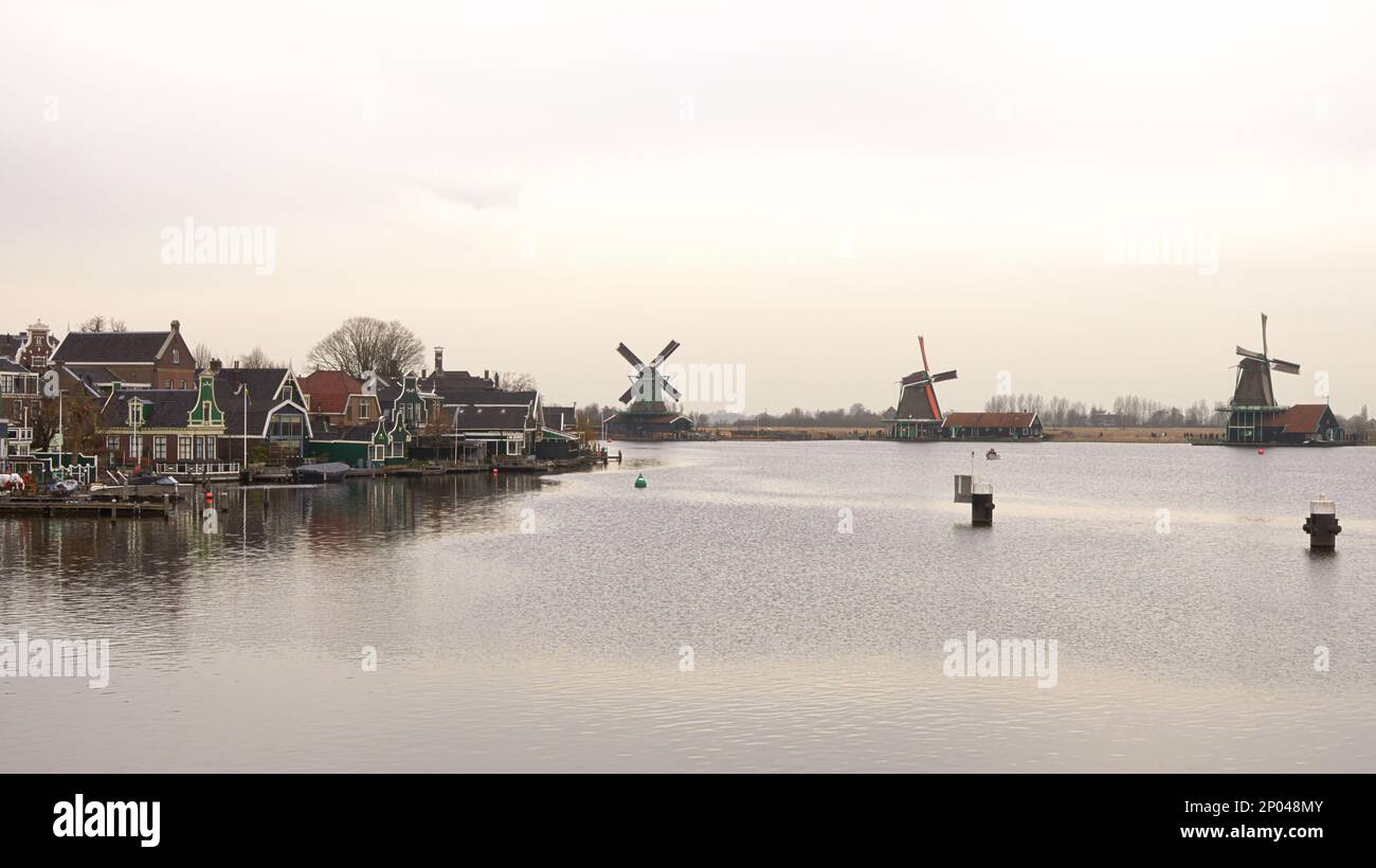 Zaanse Schans windmills across the Zaan river, with Zaandijk on the ...