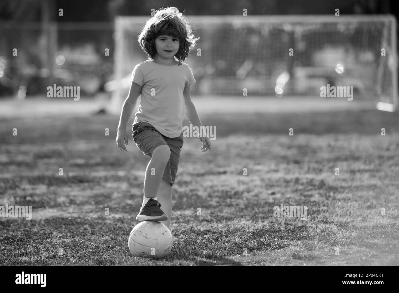 Soccer kids, child boy play football outdoor. Young boy with soccer ...