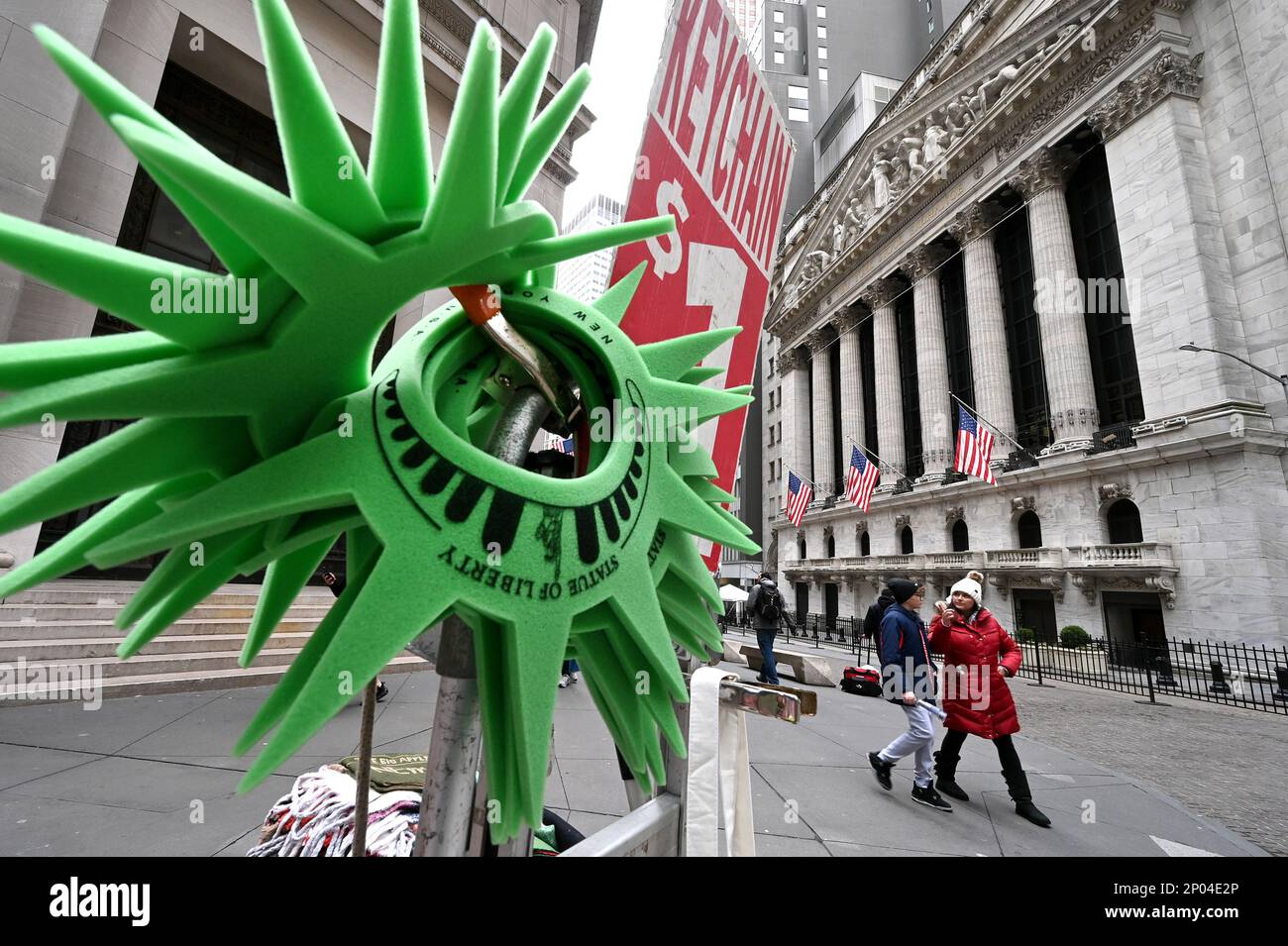 A souvenir vendor sells foam Statue of Liberty crowns outside of the ...