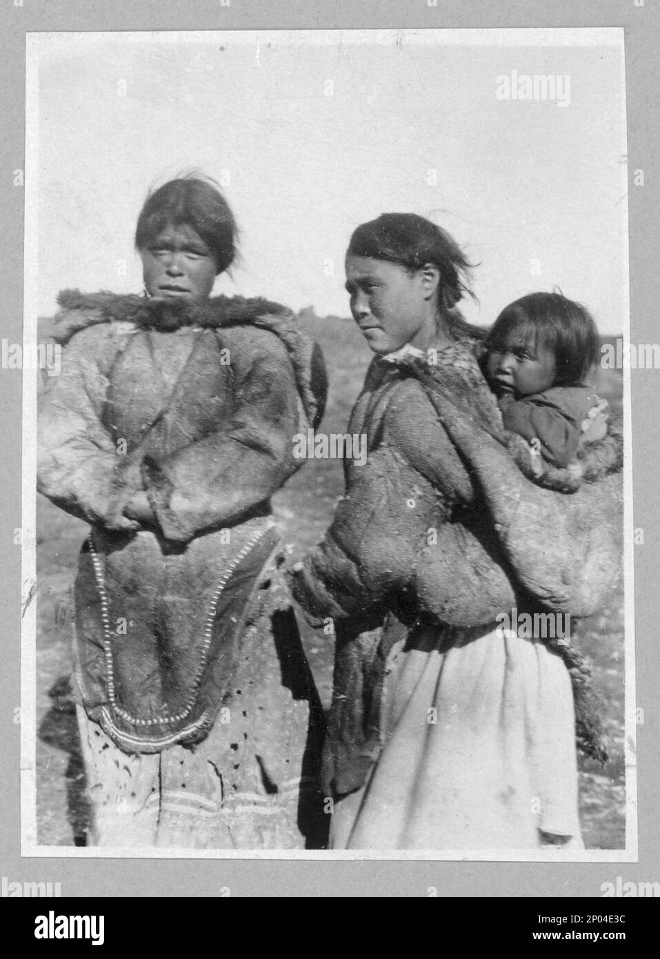 Eskimo women wearing clothing made from eider duck skins. Frank and ...