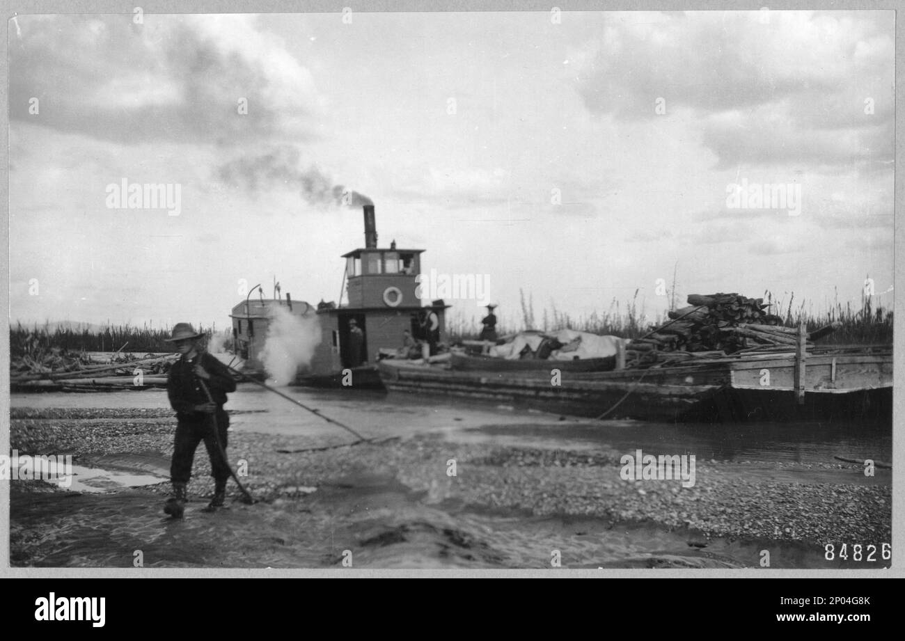 Steamer Little Delta and barge on sand bar. Frank and Frances Carpenter ...