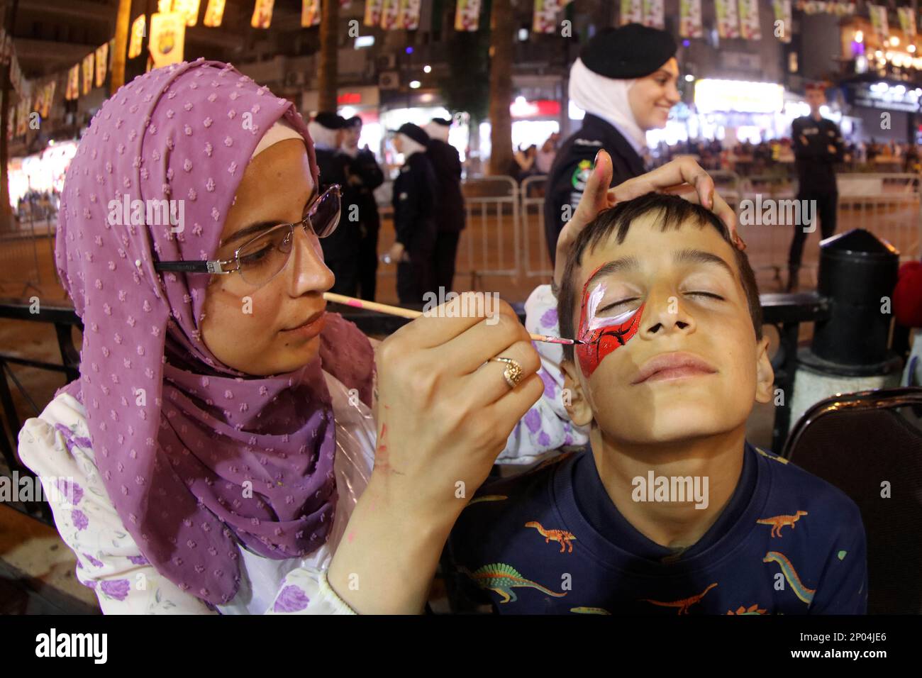 Amman, Jordan. 2nd Mar, 2023. A boy has face painted during the Amman ...
