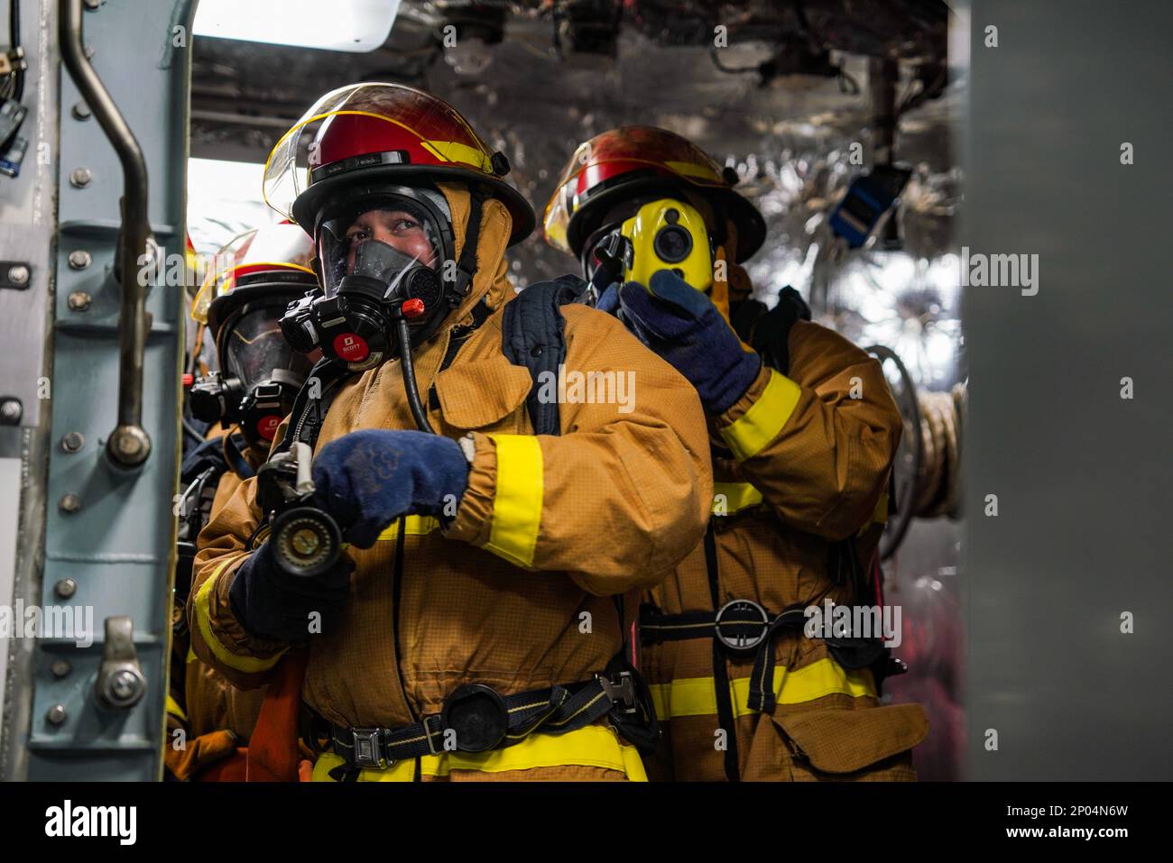 SINGAPORE (Jan. 25, 2023) Fire Controlman 2nd Class Jaime Blanco, left ...