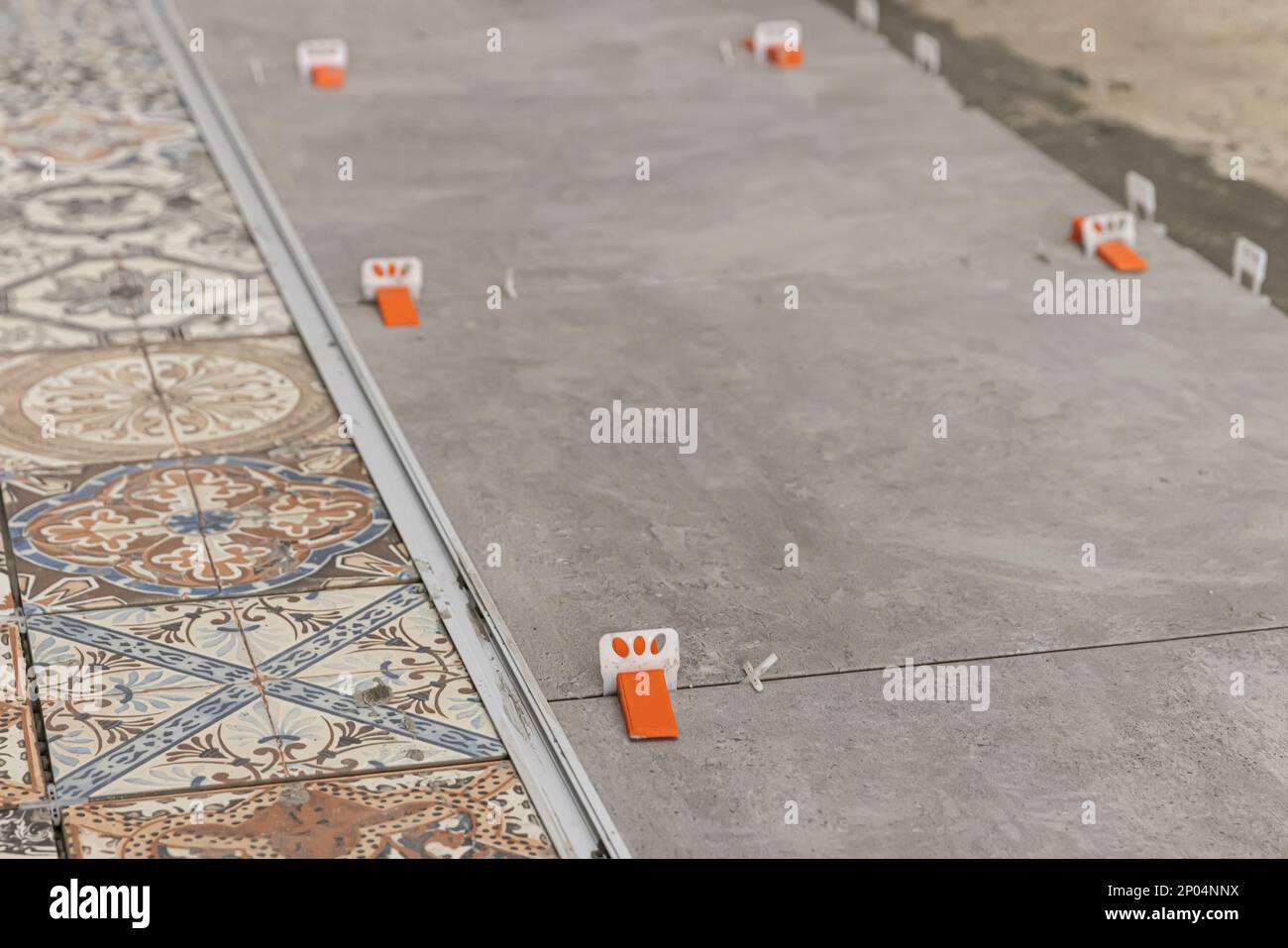 industrial ceramic builder worker installing floor tile at repair ...