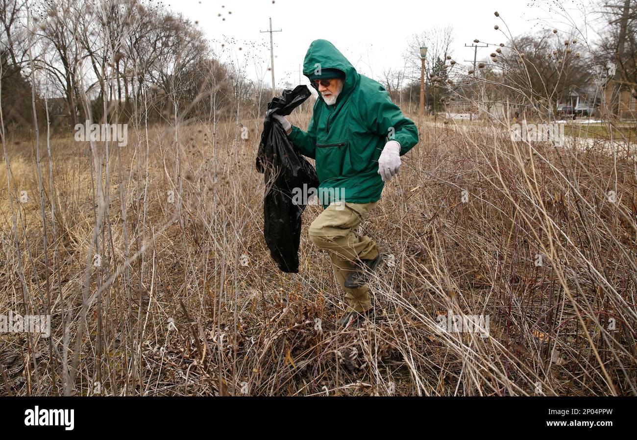 Volunteer coordinator Keith Olson looks for trash in the Great Western ...