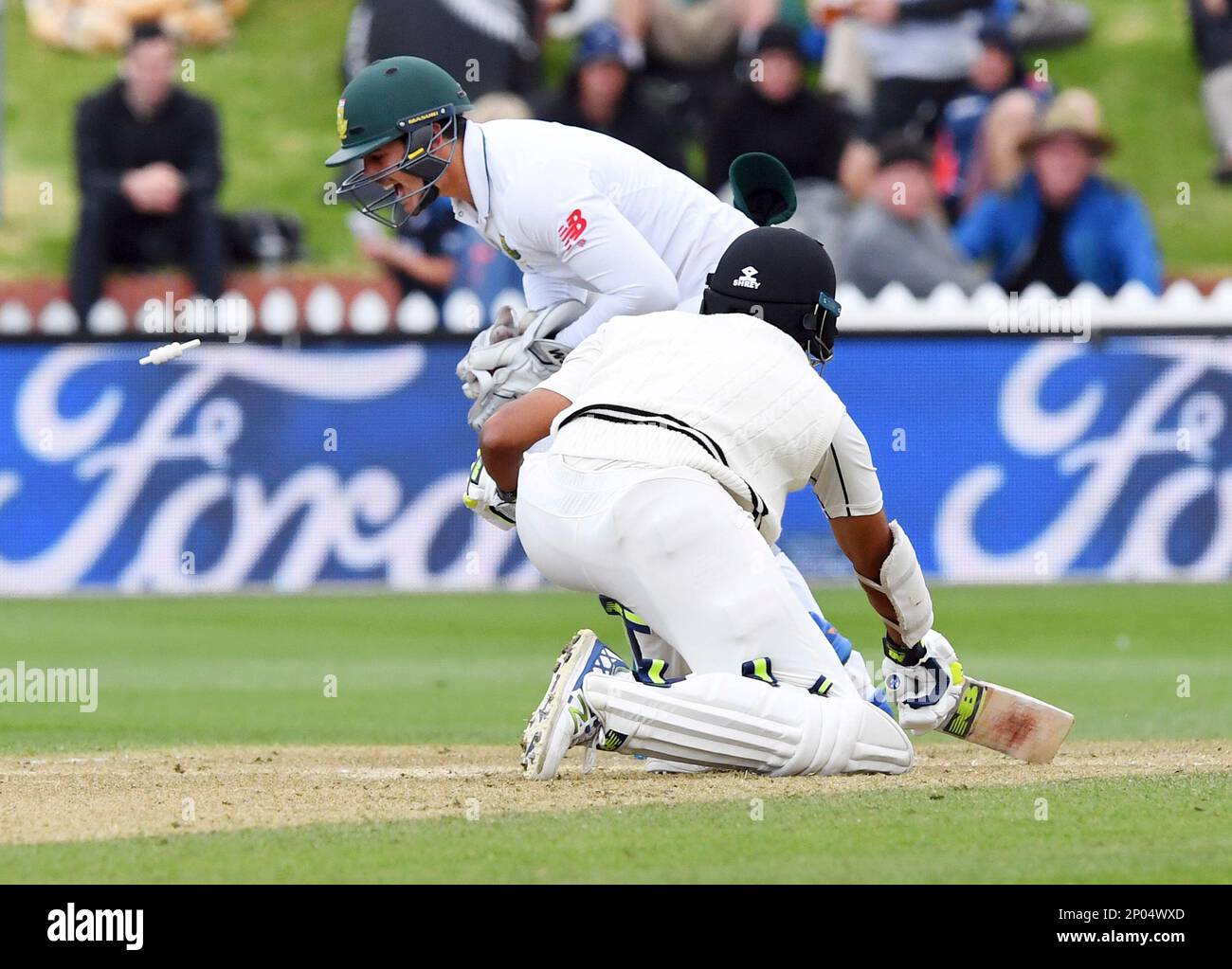 South Africa's Quentin de Kock, left, stumps New Zealand's Jeet Raval ...