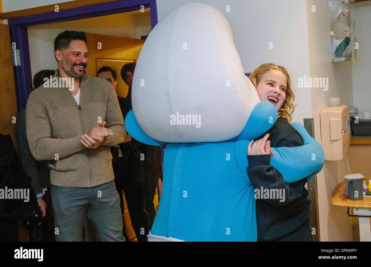 Actor Joe Manganiello, left, looks on as a performer dressed as Hefty ...