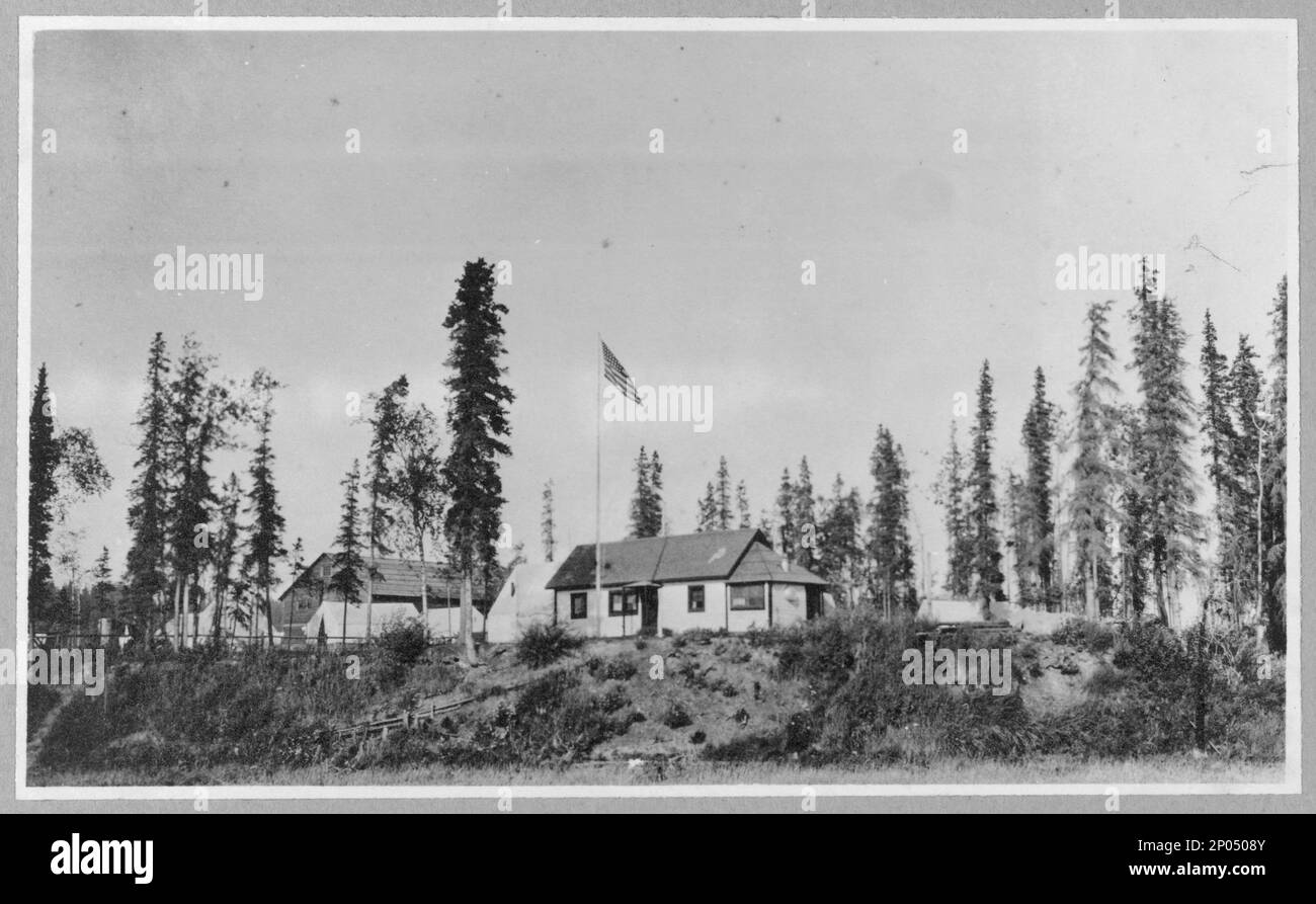 Building with American flag raised. Frank and Frances Carpenter ...