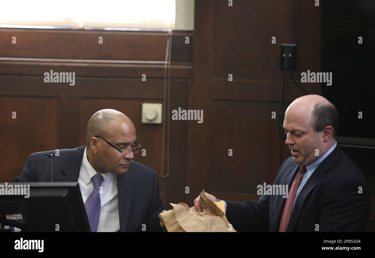 Boston Police Sergeant Detective Kevin Witherspoon, left, is asked to ...