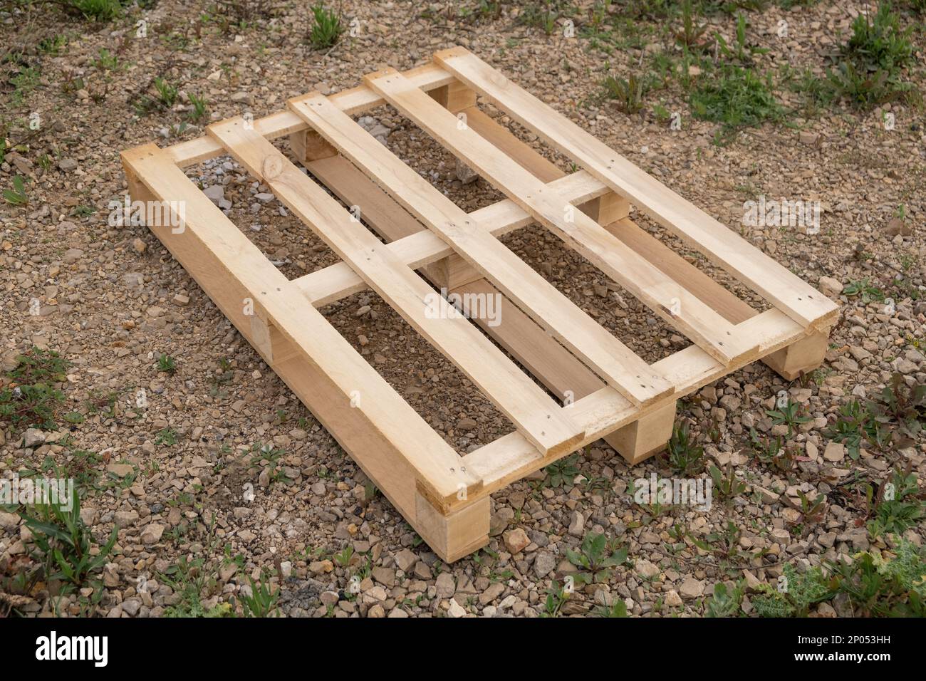 Wooden pallet on ground. lost and empty Stock Photo - Alamy