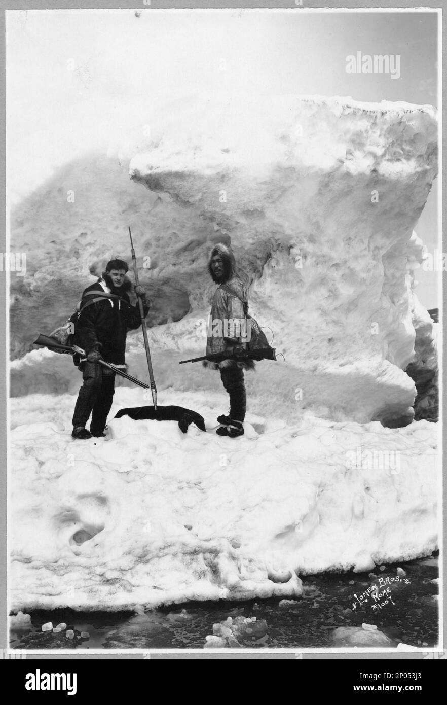 Eskimo with another man in winter scene. Frank and Frances Carpenter ...