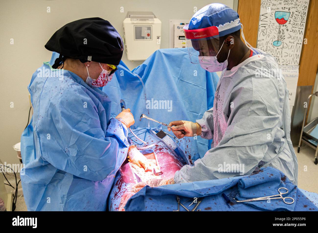 Instructors act as surgeons during a mock surgery while 68D operating ...