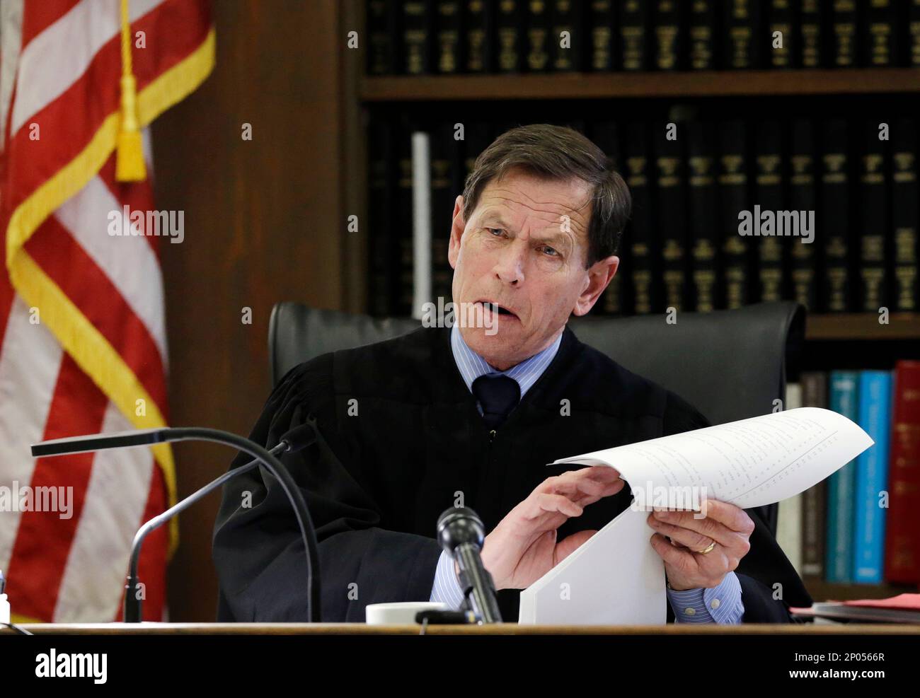 Judge Jeffrey Locke speaks to an attorney during defendant Aaron ...