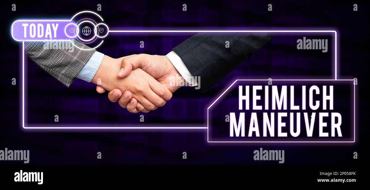 Conceptual caption Heimlich Maneuver. Word Written on application of ...