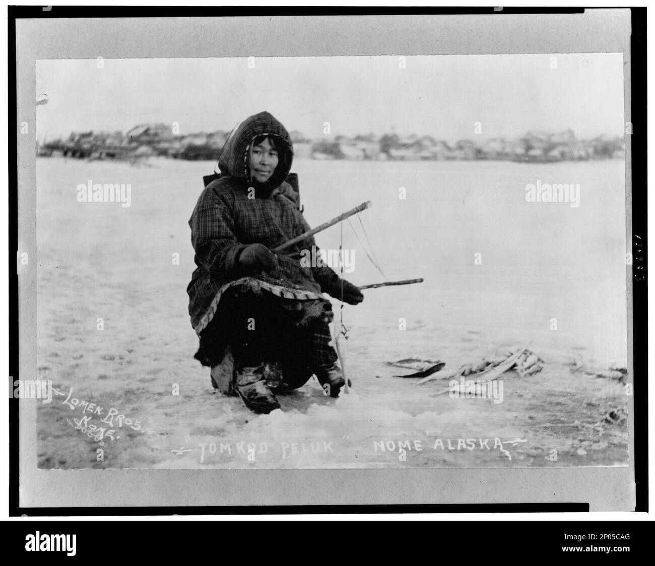 "Tom Kod Peluk," Nome, Alaska , Inuit woman ice fishing, Nome, Alaska ...
