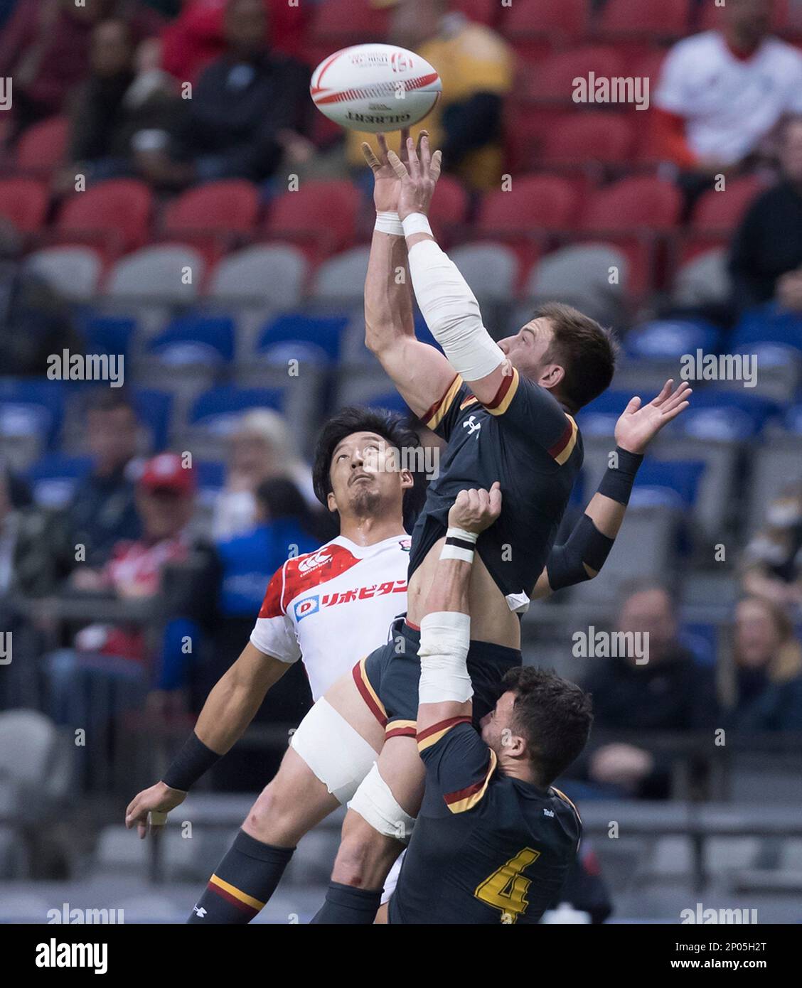 Wales' Lloyd Evans, top right, is lifted by Luke Morgan, right, as he ...