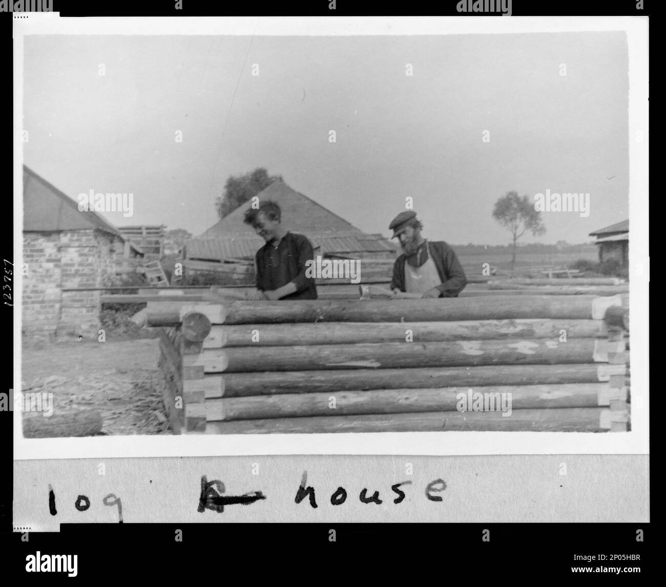 Two men building a log house, Kolhoz (collective farm), near Gorky ...
