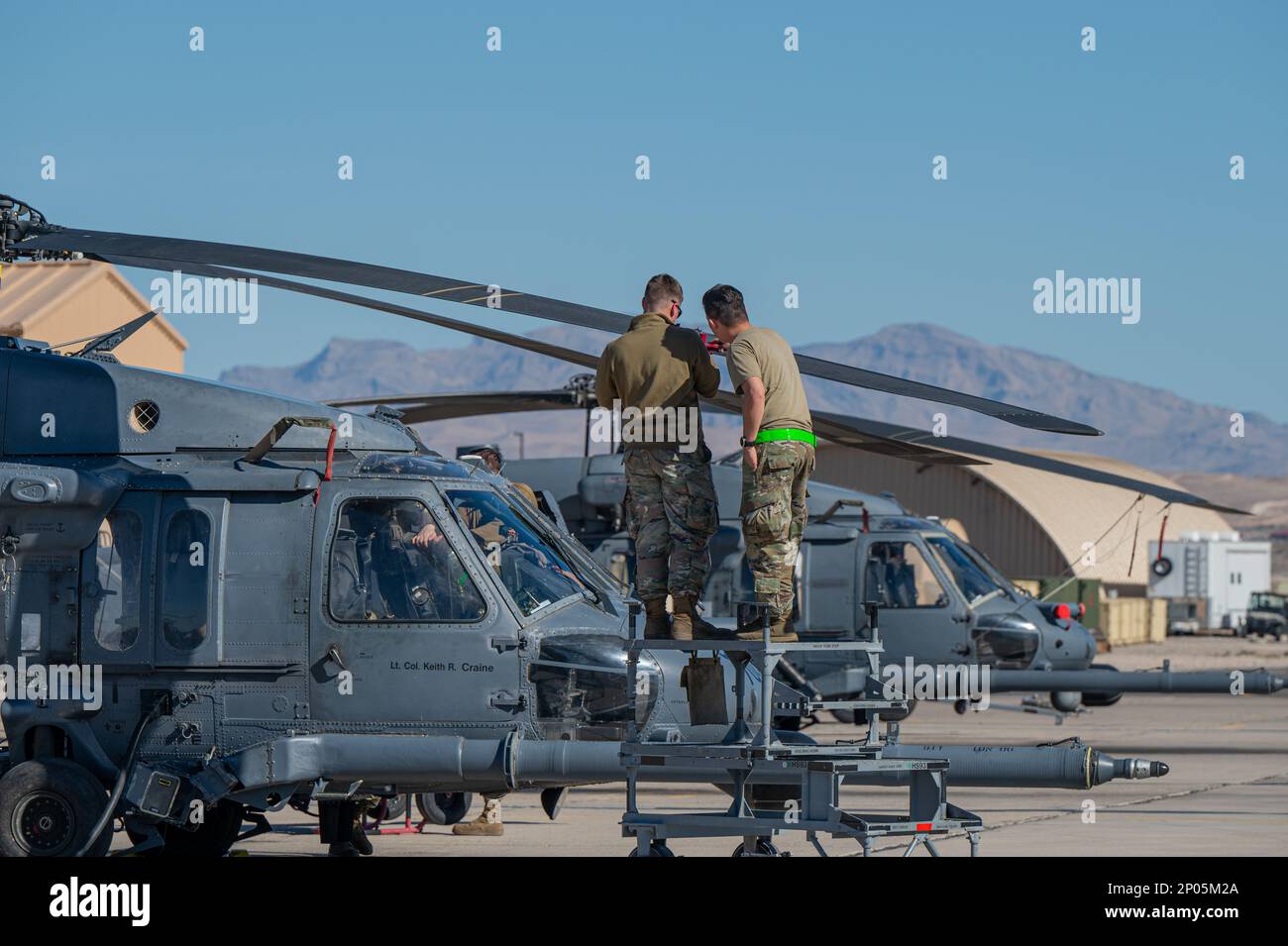 U.S. Air Force Airmen perform preflight checks on an HH-60G Pave Hawk ...