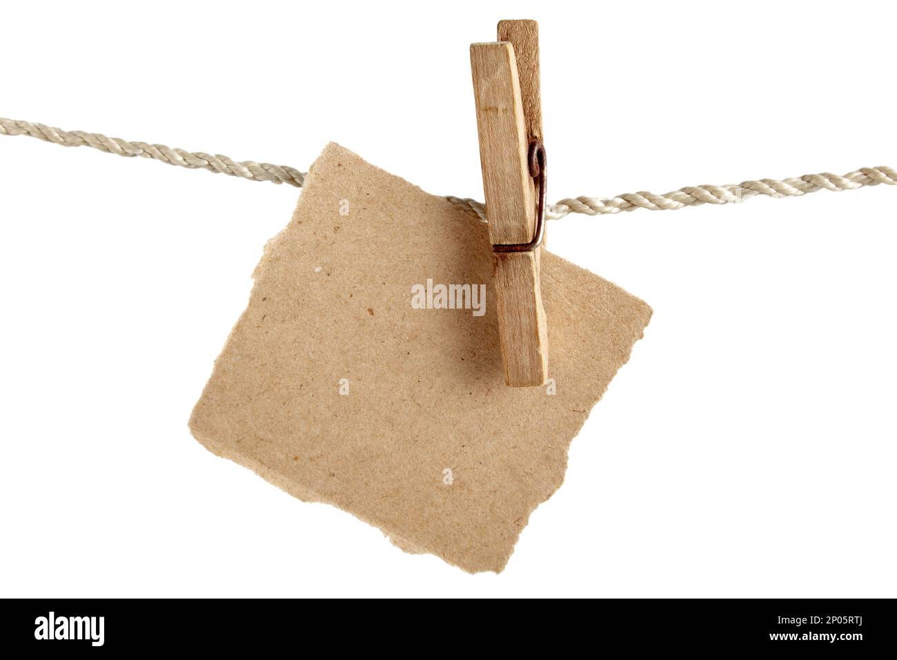 Craft note paper fastened with a vintage clothespin on a rope on a ...