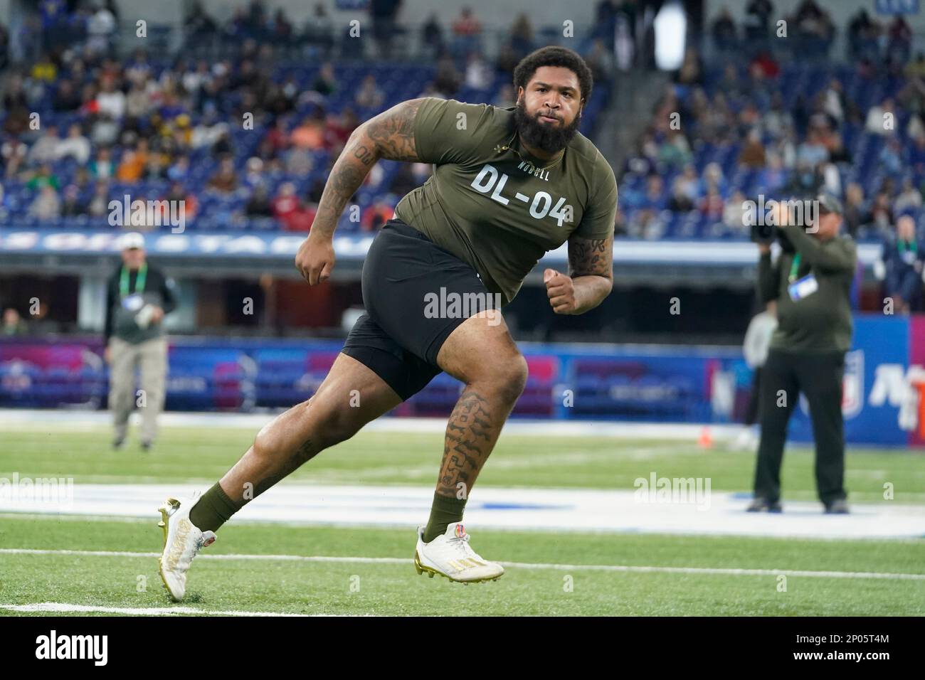 Coastal Carolina defensive lineman Jerrod Clark runs a drill at the NFL ...