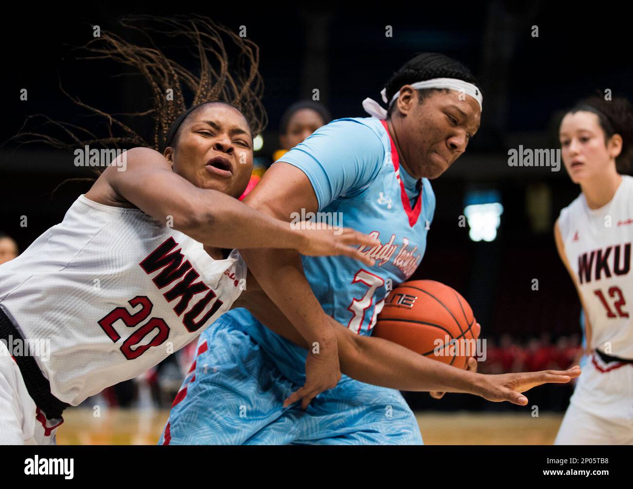 Western Kentucky guard Ima Akpan (20) fouls Louisiana Tech forward ...