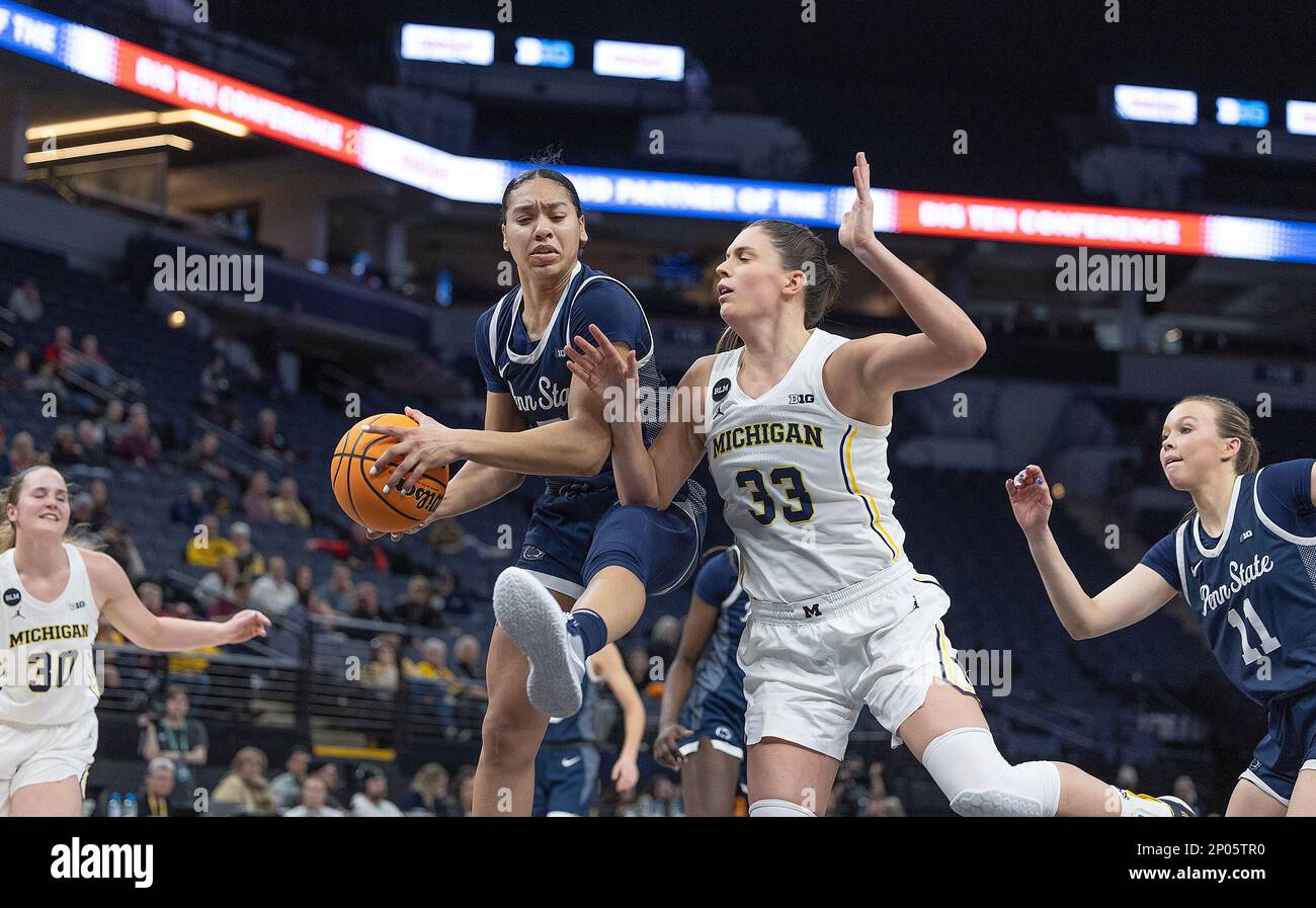Penn State guard Leilani Kapinus grabs a rebound next to Michigan ...