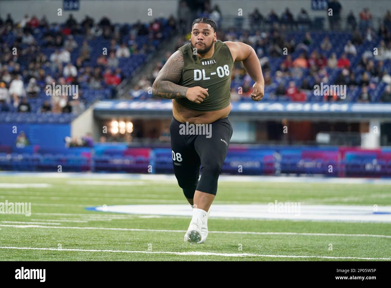 Baylor defensive lineman Siaki Ika runs a drill at the NFL football ...