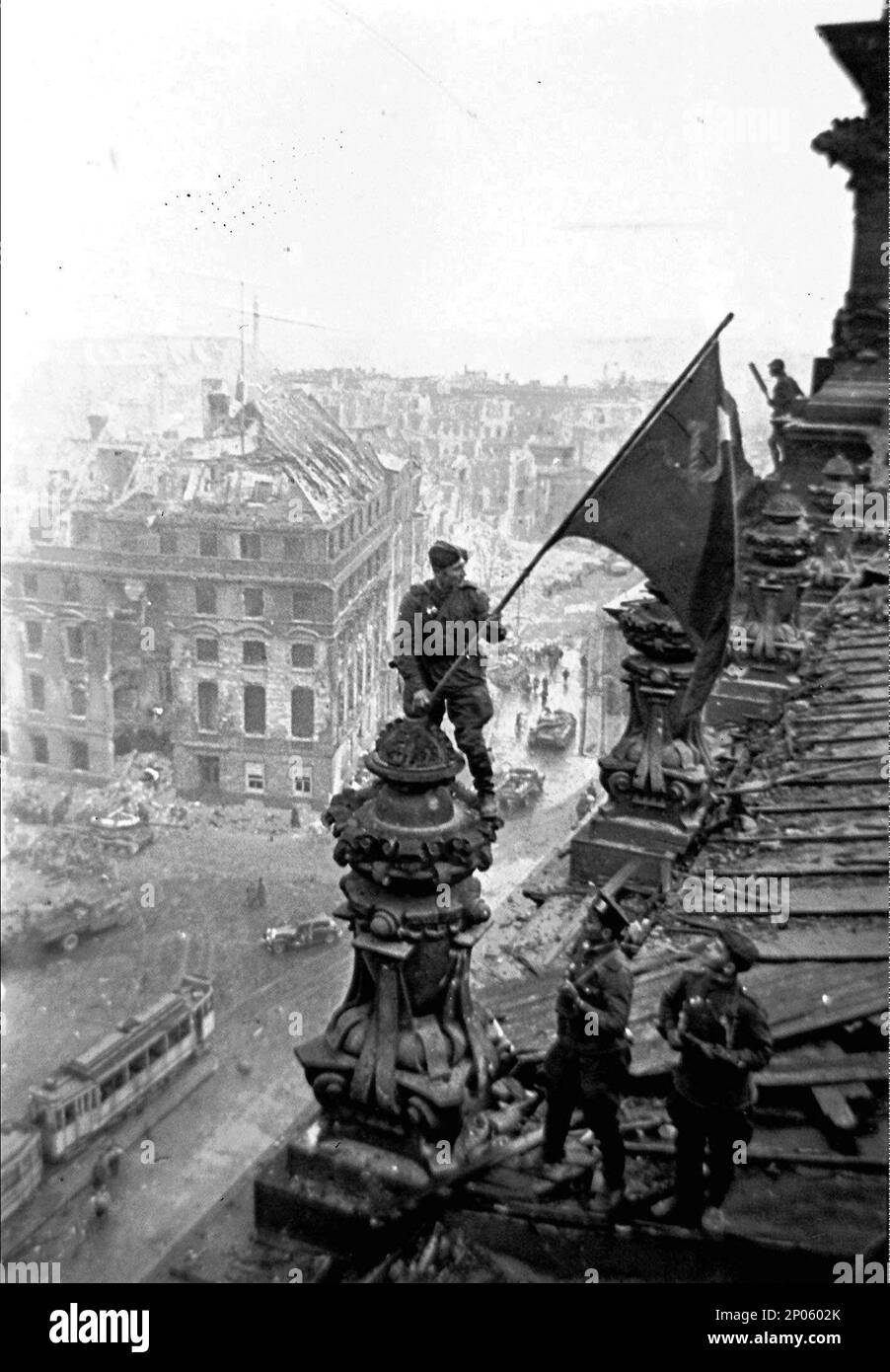 FILE- In this May 2, 1945 file photo, Soviet soldiers hoist the red ...