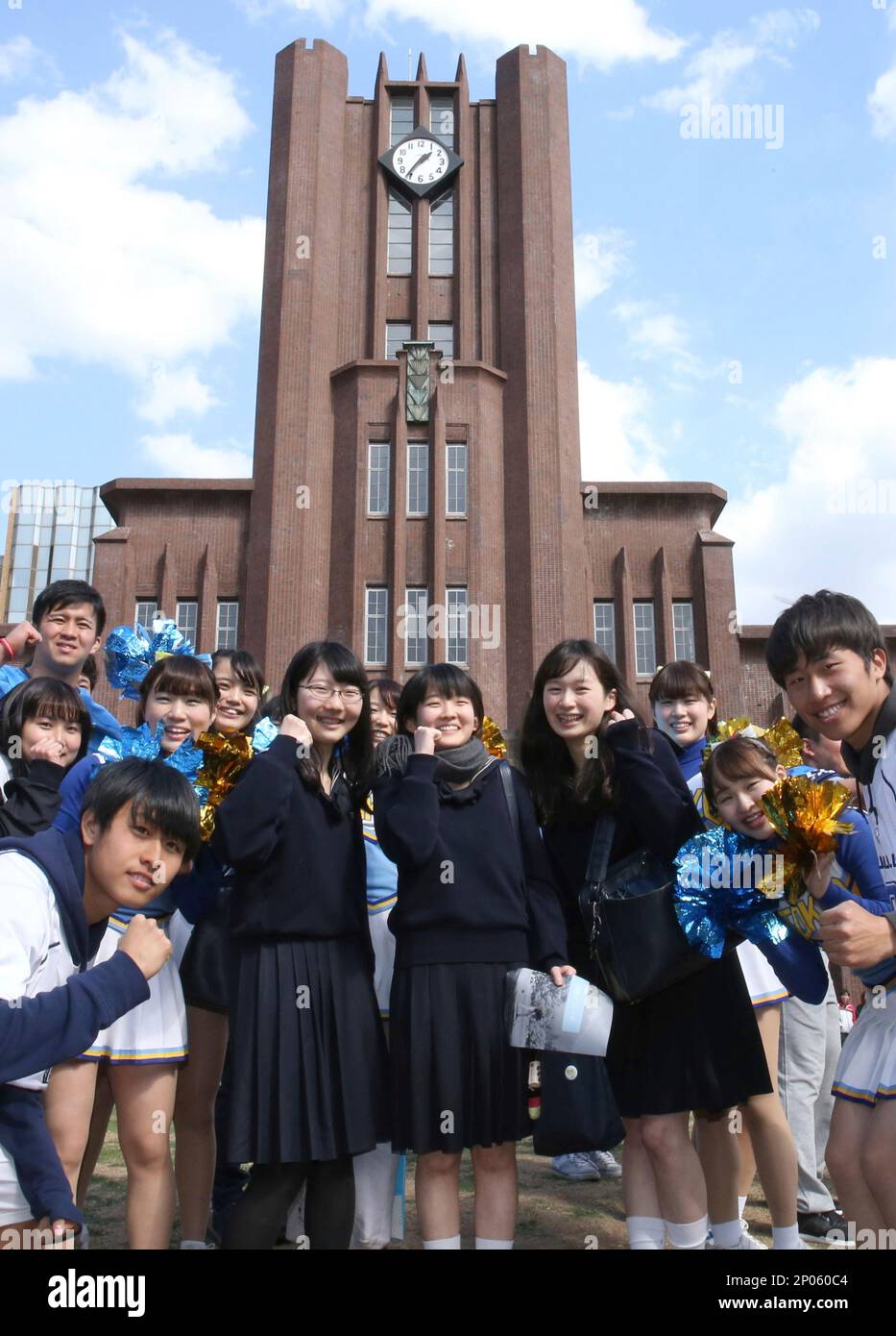 Female students pose after passing the entrance exam of the University ...