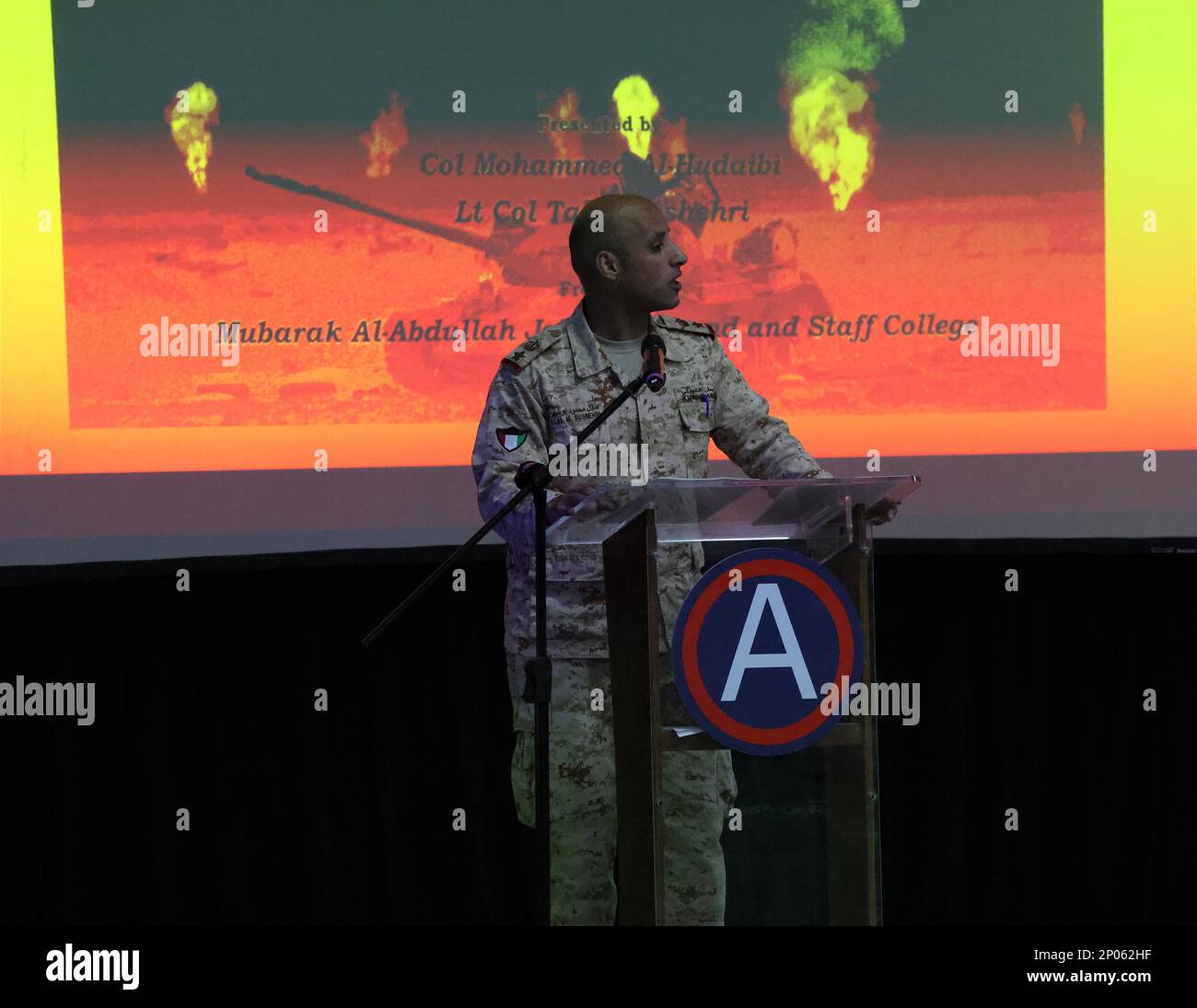 Lt. Col. Talal Bushehri presents the lecture. To commemorate the 32nd ...