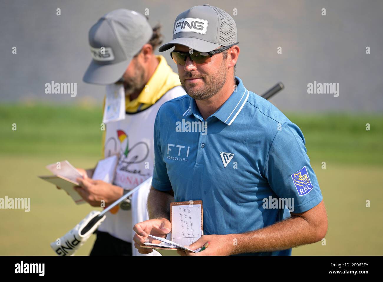 Corey Conners, of Canada, walks off the 18th green after putting during ...