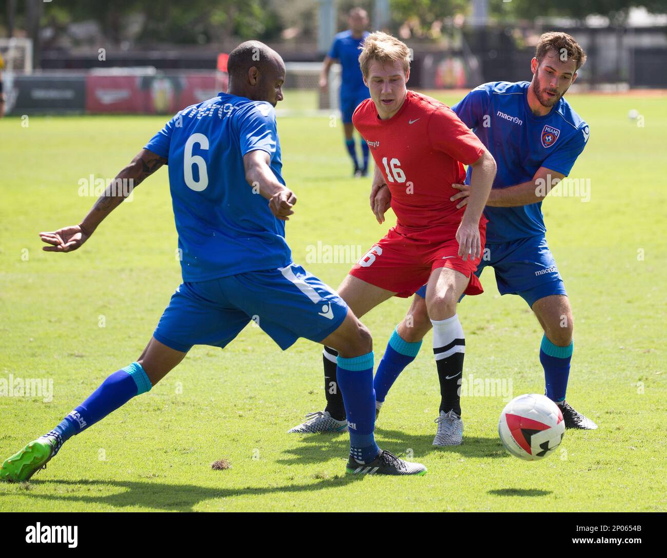 March 04, 2017: Miami FC midfielder Ariel Pedro Martinez (6) (left) and ...