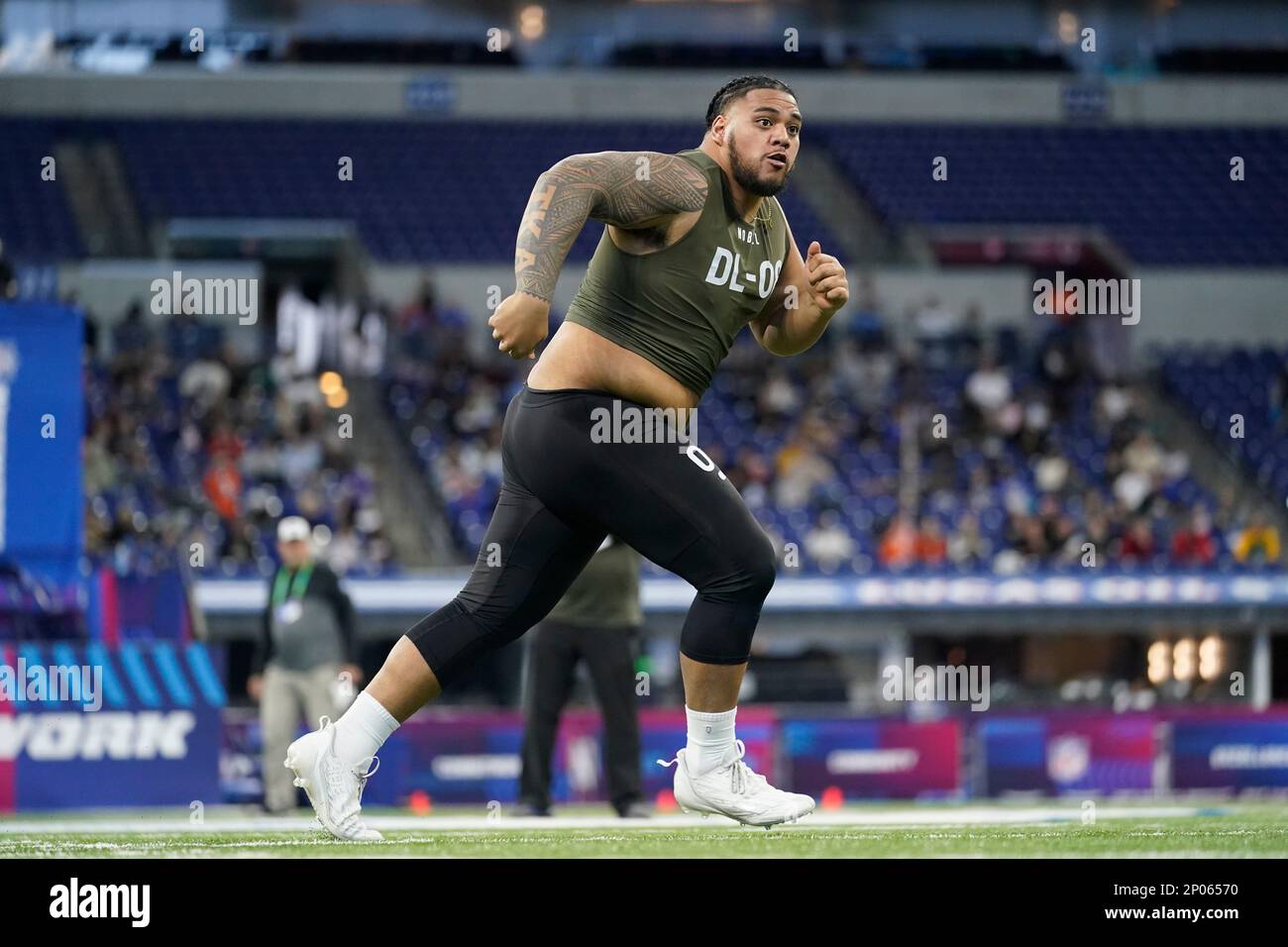 Baylor defensive lineman Siaki Ika runs a drill at the NFL football ...