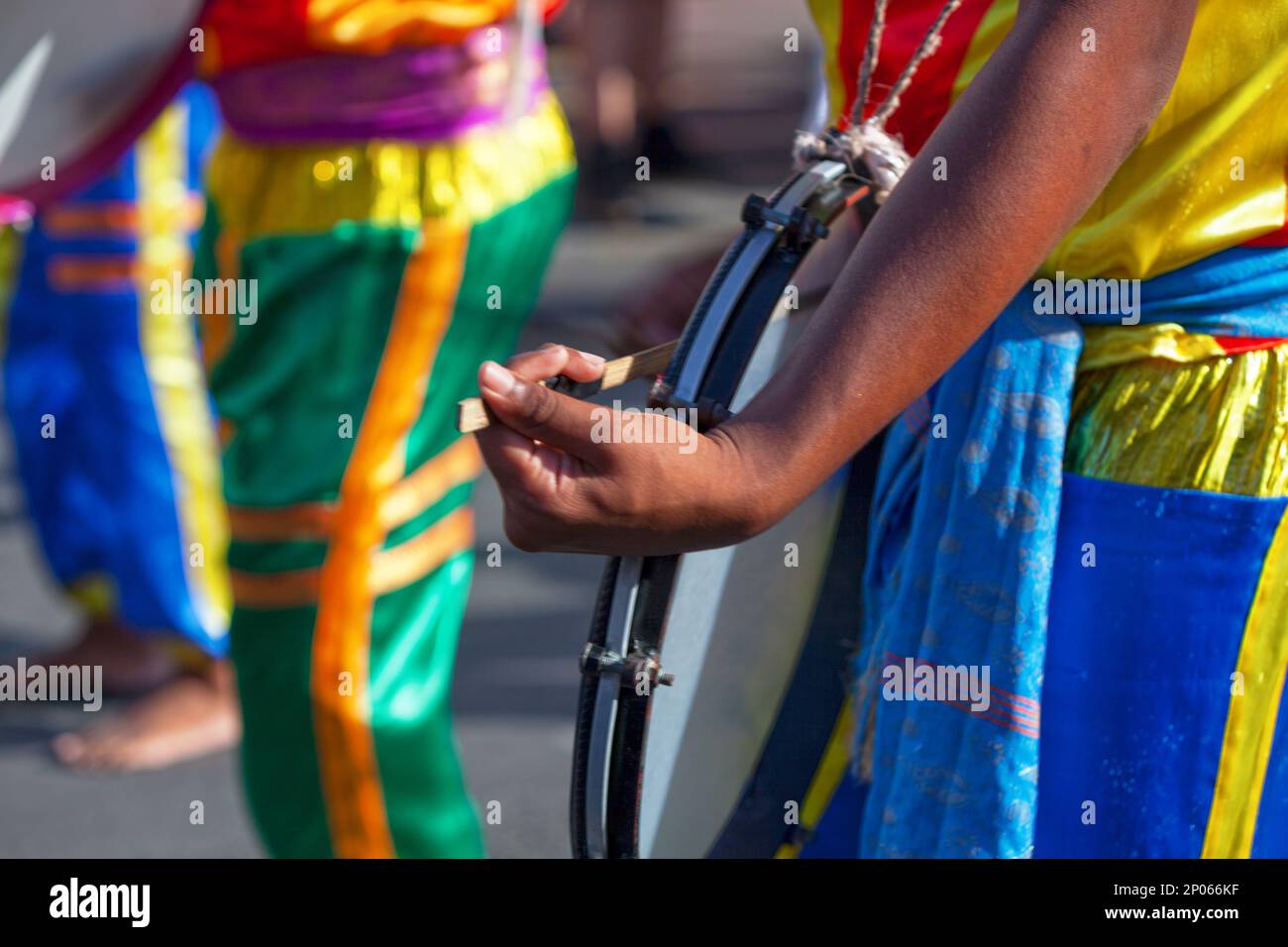 Percussionist playing with a frame drum during the carnival of the ...