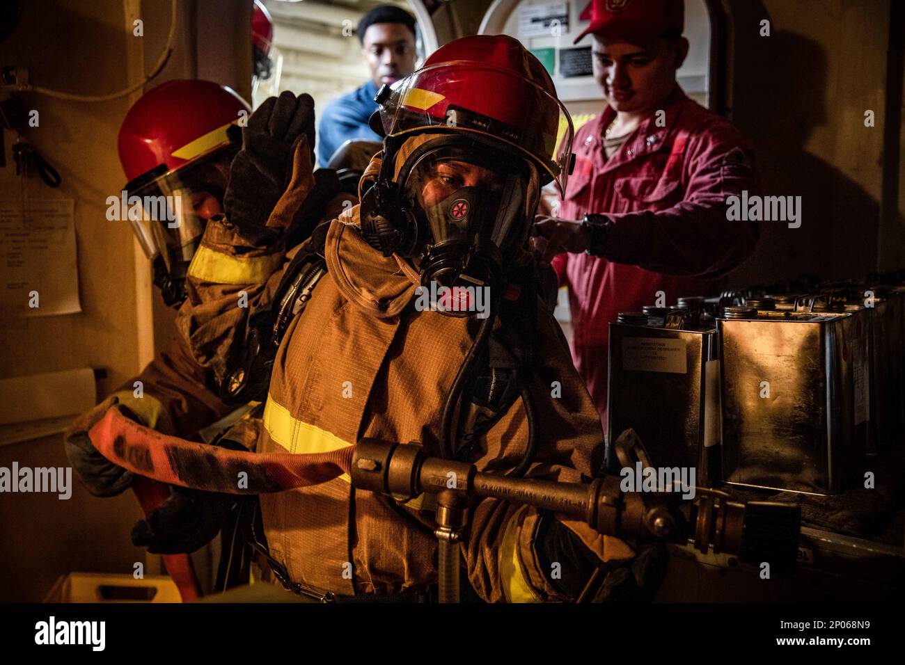 Fireman Joseph, center, assigned to the San Antonio-class amphibious ...