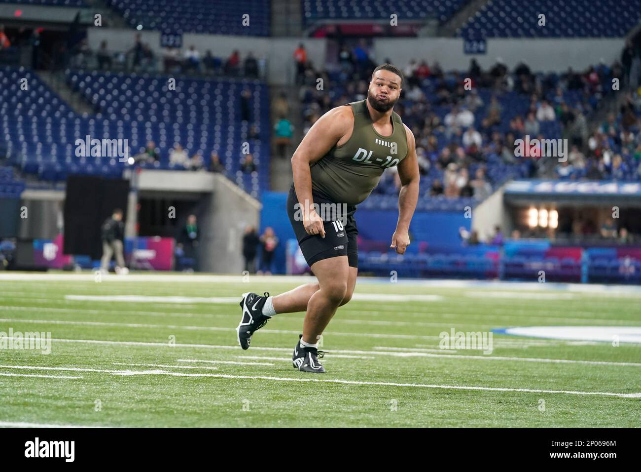 Penn State defensive lineman PJ Mustipher runs a drill at the NFL ...