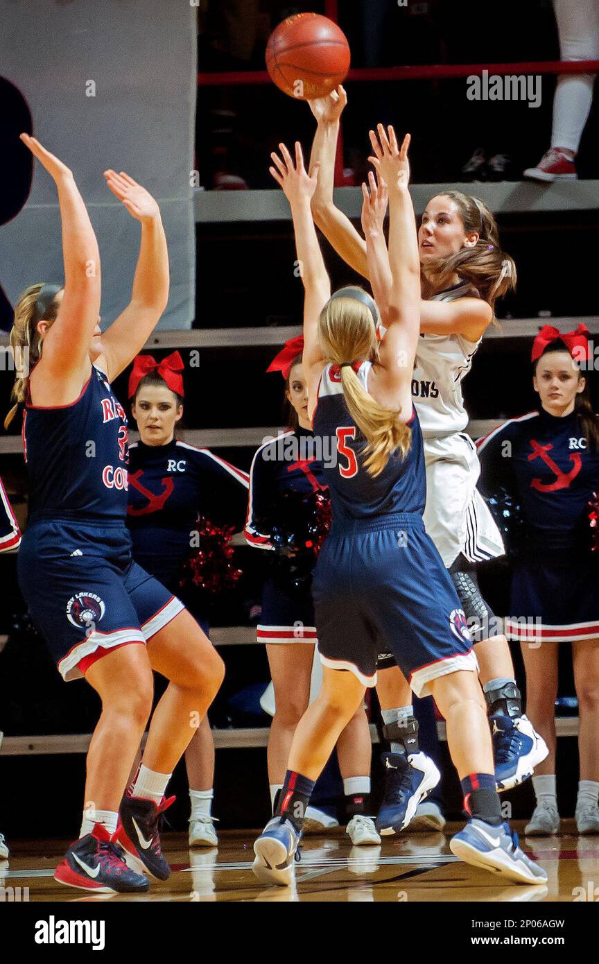 Monroe County's Kelsey Johnson (from right) is double teamed by Russell ...
